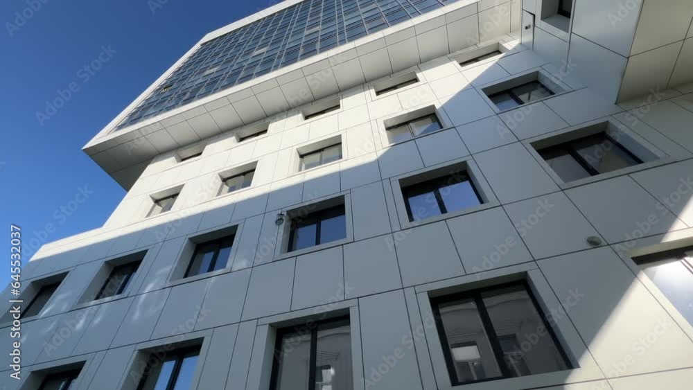 Hospital exterior with transition between buildings. Bottom up view of ...