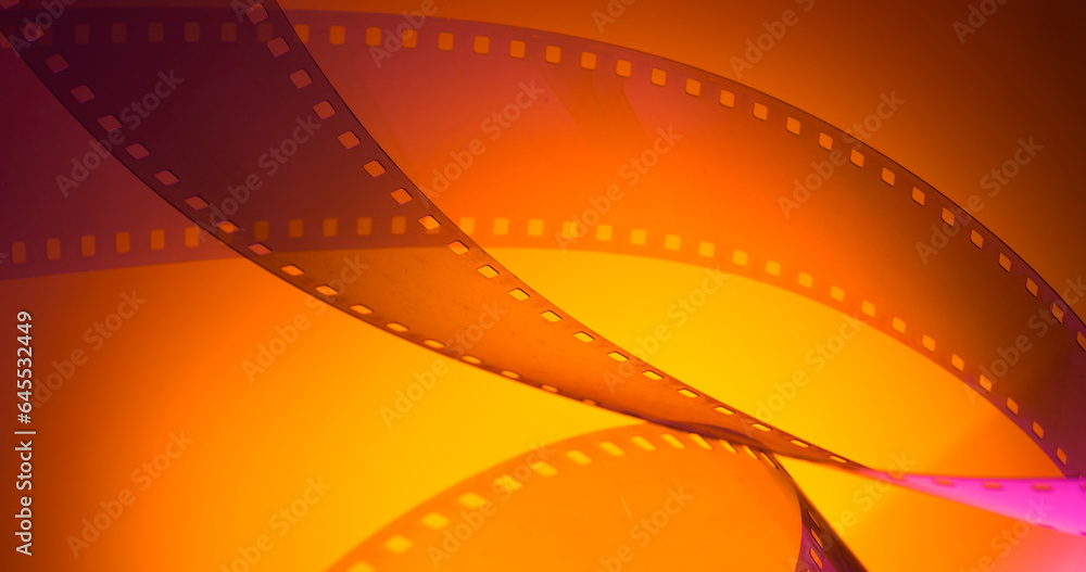 orange yellow color background with film strip. cinematography premiere ...