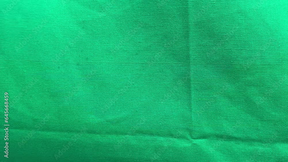 Spraying water mist from foggy on green screen chroma key cloth fabric ...
