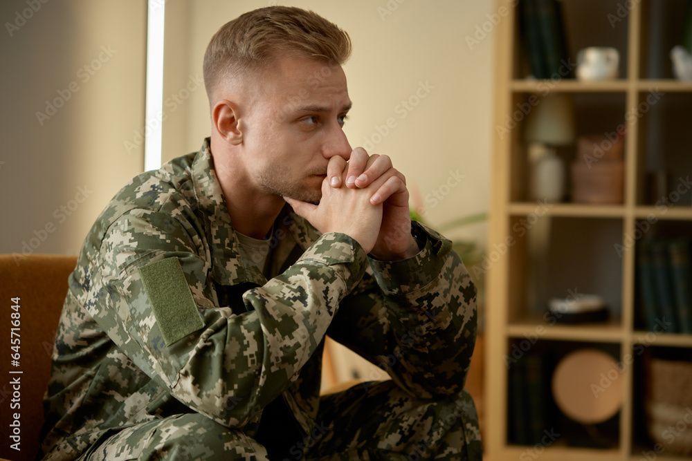 Poster Upset soldier in military uniform thinking worrying about his ...