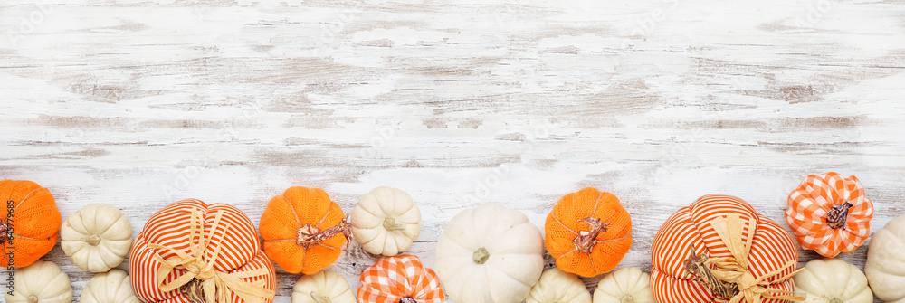 Autumn farmhouse pumpkin bottom border over a white wood banner ...