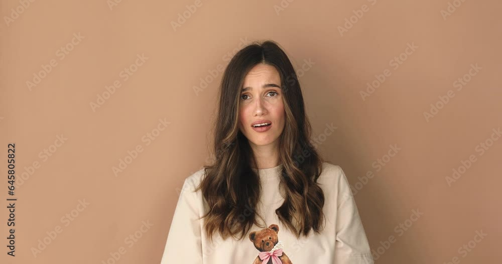 Fake, crying woman face in studio with hands gesture for sad, bullying ...