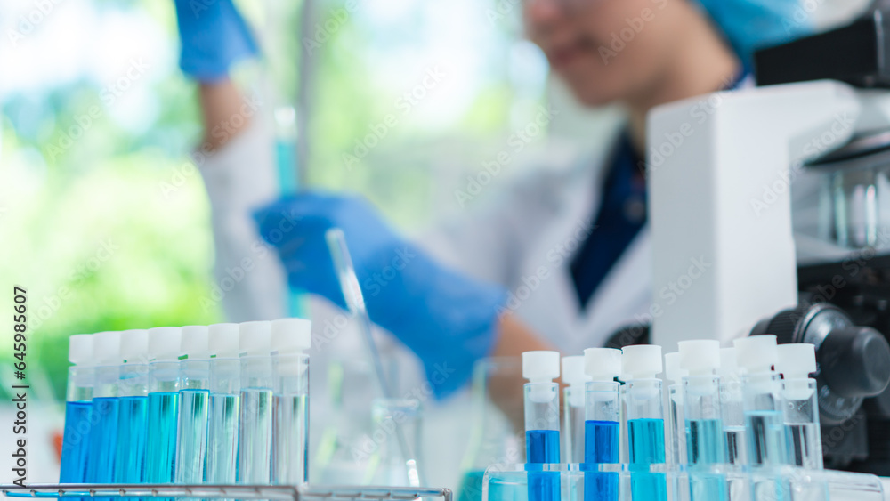 Scientist wearing glassware research in chemistry laboratory for ...