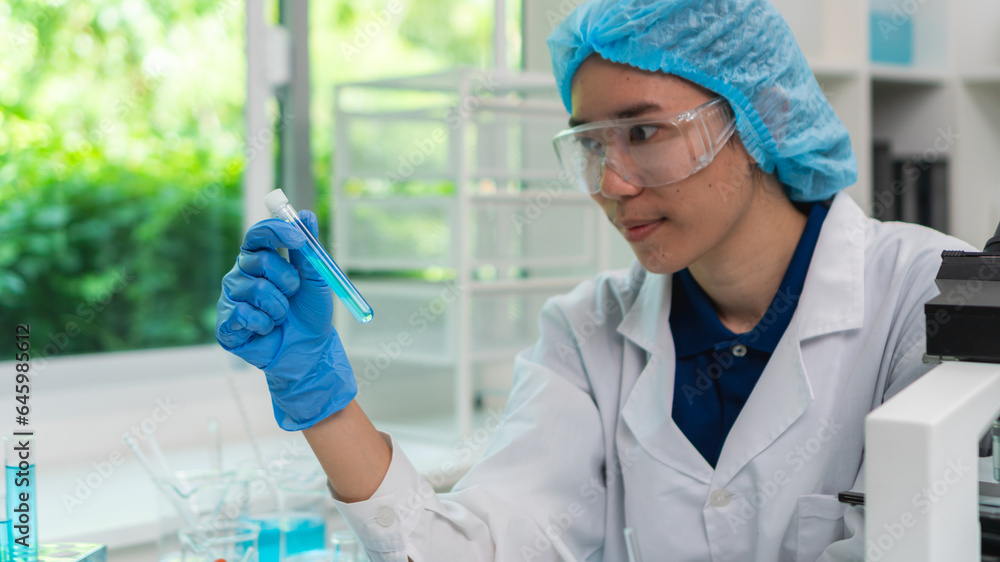 Scientist wearing glassware research in chemistry laboratory for ...