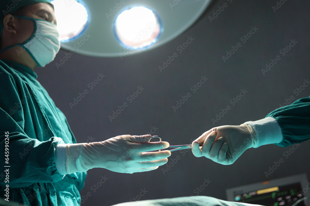 Surgeon doctor holding surgical scissors and passing surgical equipment ...