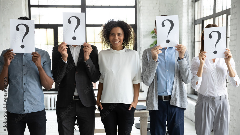 Smiling hired african American young female applicant stand in row line ...