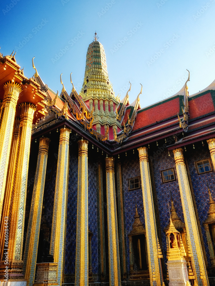 Thai temple graced with elaborate gilded and azure columns, a lofty ...