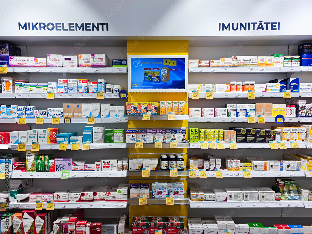 LATVIA, RIGA, 10, SEPTEMBER, 2023: Shelves in the pharmacy with vitamins and mineral supplements ...