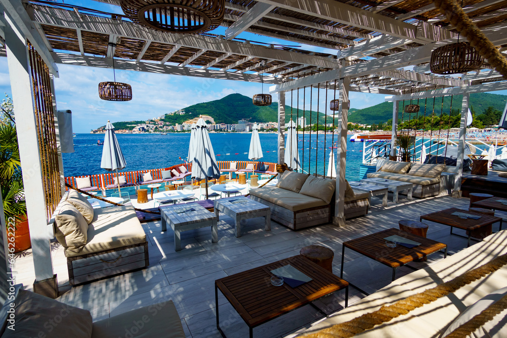 beach cafe interior on the seashore in a resort town, blue sunny sky ...