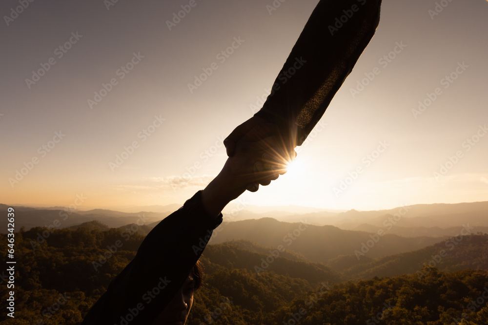 Silhouette of reaching, giving a helping hand, hope and support each ...