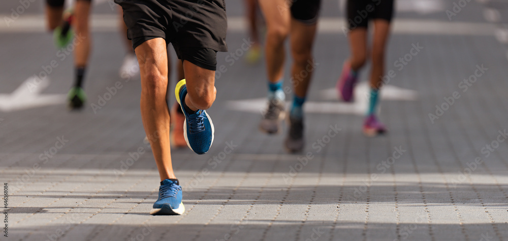 Marathon runners running on city road, large group of runners Stock ...