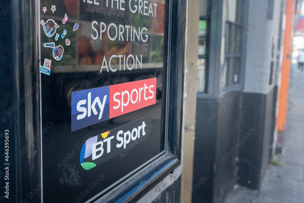 LONDON- Sky Sports and BT Sport logo on exterior of pub- advertising ...