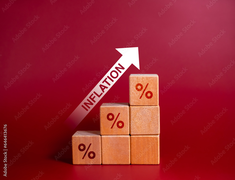 Shining rise up arrow increase with text "INFLATION" on wooden cube ...