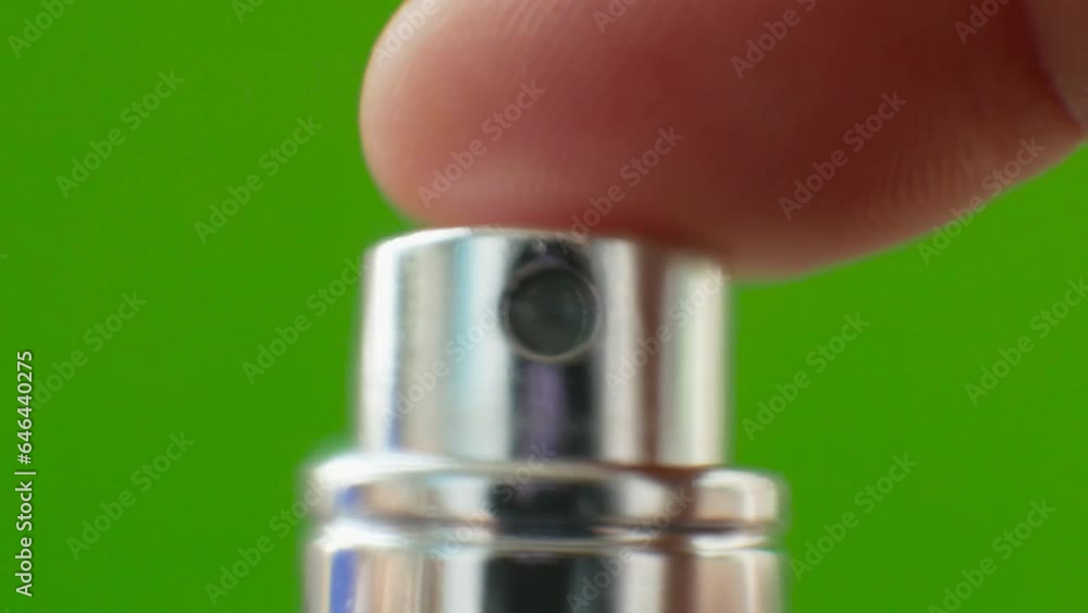 Aroma diffuser spray, puff with toilet water button on a green ...