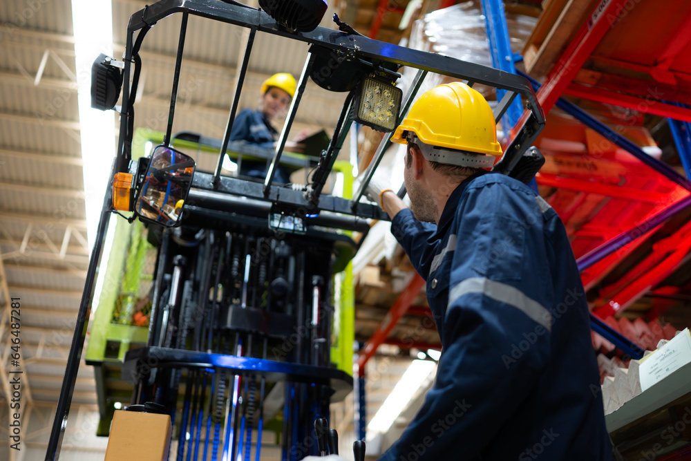 Warehouse workers using forklift to check and counting in a large ...