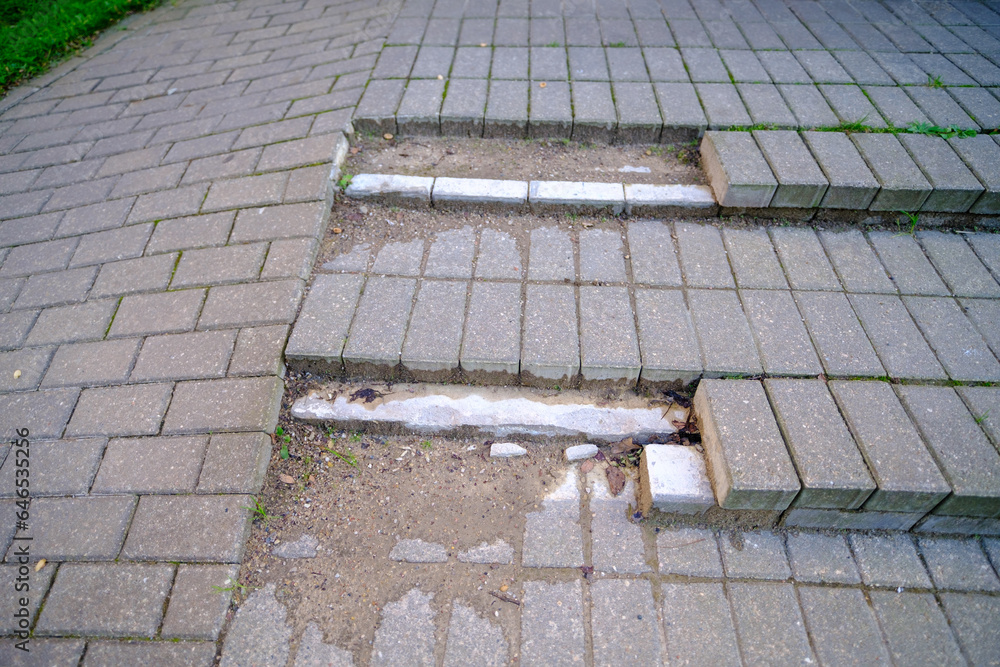 Damaged stair steps made from paving slab unsafe for pedestrians ...
