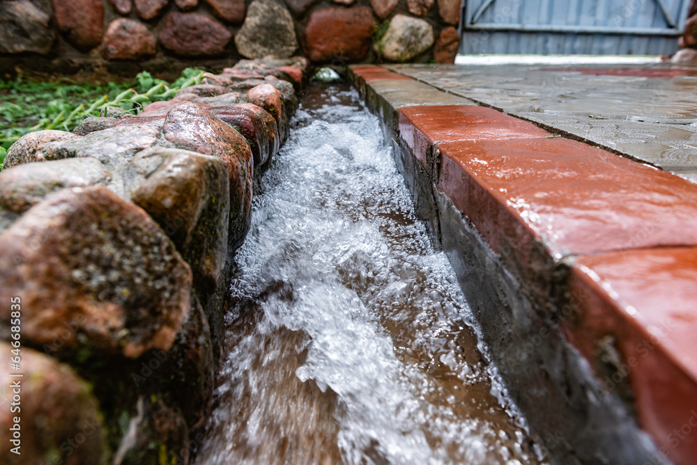 Water flows into the drainage system for domestic wastewater and ...