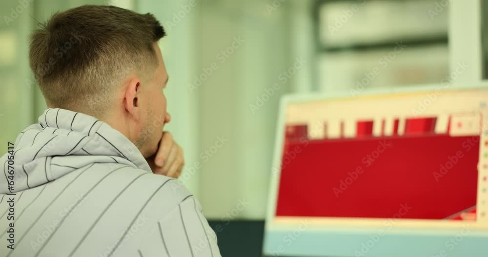 Designer studies 3D model of parts on computer monitor in office. Part ...