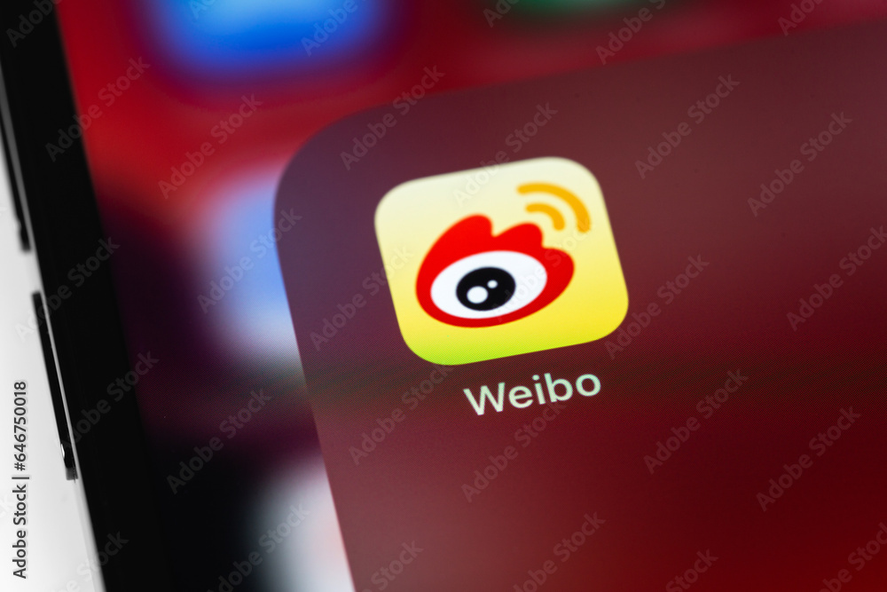 Sina Weibo mobile app icon on a screen smartphone closeup. Sina Weibo - Chinese microblogging ...