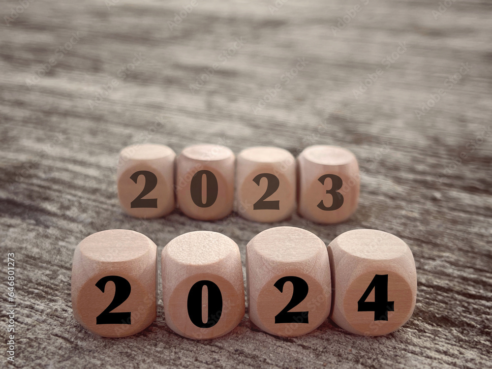 New Year Celebration Concept. Figure 2024 and blurry 2023 written on ...