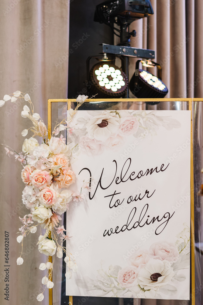 Welcome to our wedding - sign for guests at entrance. Golden frame or ...