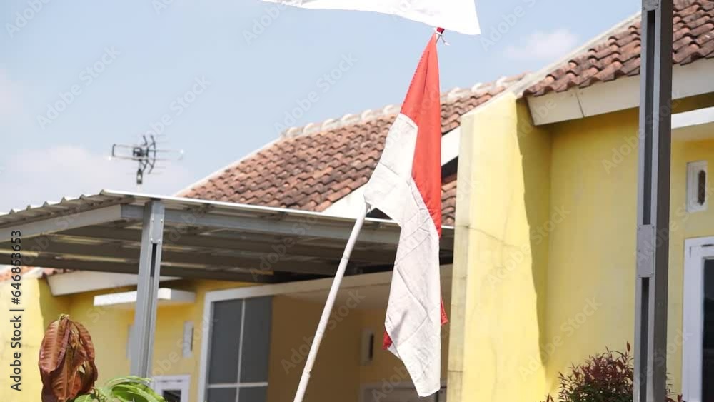 The Indonesian flag called Sang Saka Merah Putih flies on the pole in ...