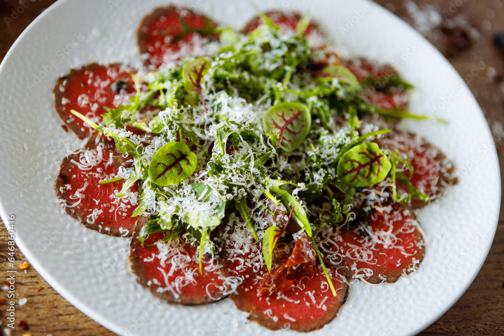Beef carpaccio. Borettane onion, sun-dried tomato, truffle dressing ...