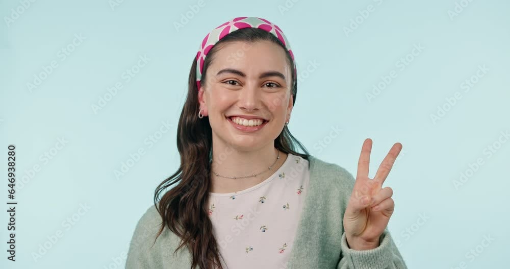 Face, happy and woman with peace in studio for winning, vote or ...