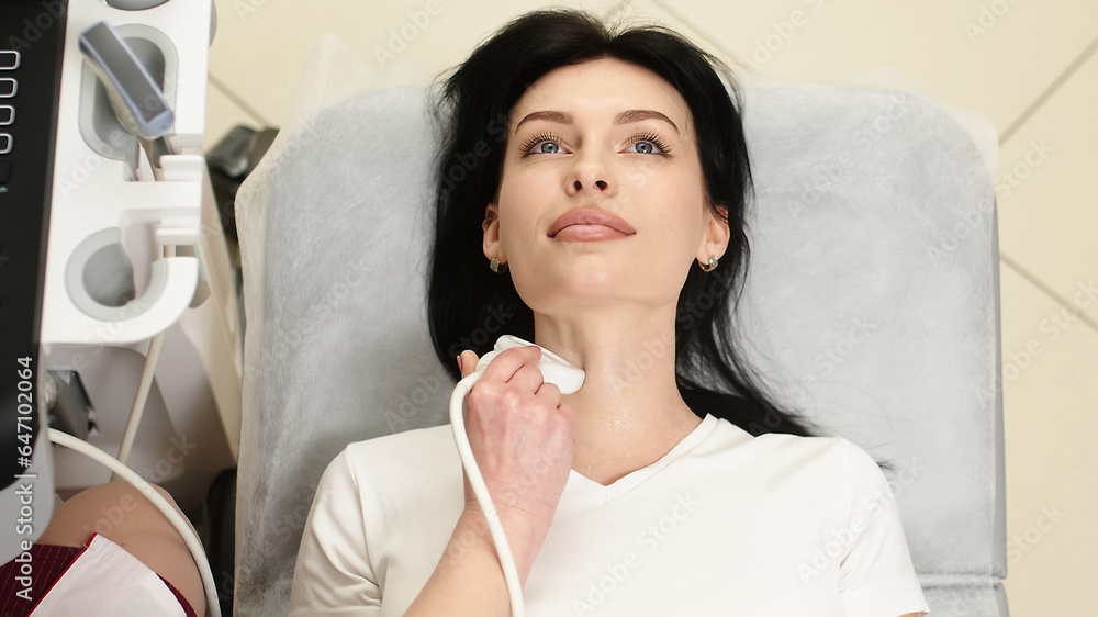 Ultrasound diagnosis of the thyroid gland of a young woman in the ...