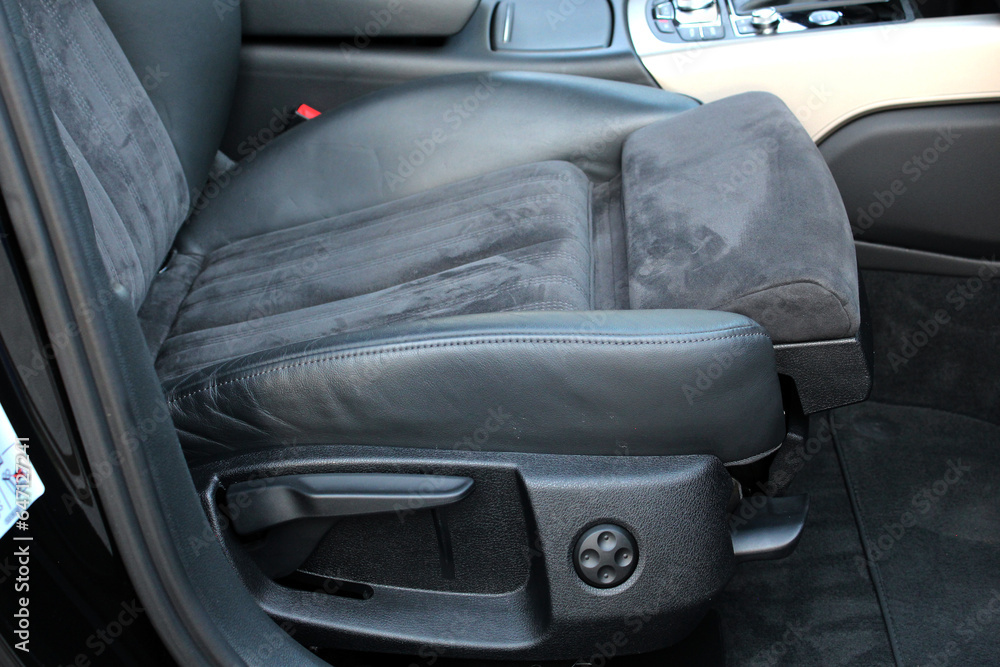 Luxury car front passenger seat and detail high end fabric and stitch ...
