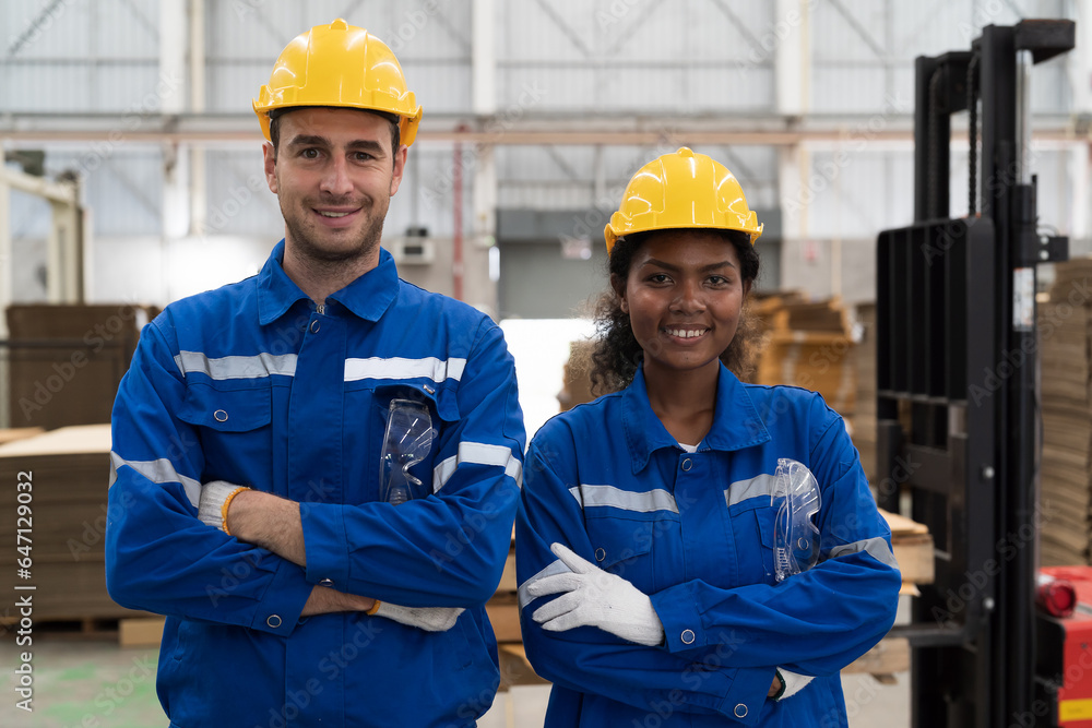 Male and female engineer worker wearing safety uniform and helmet ...