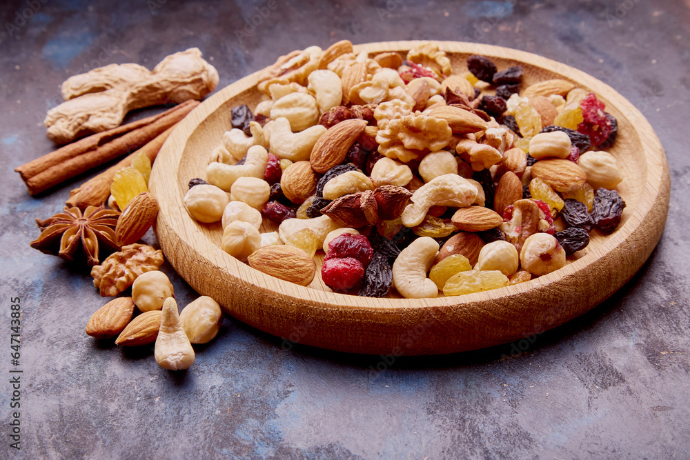 Aesthetic wooden bowl with assorted nuts, raisins and cranberries from ...