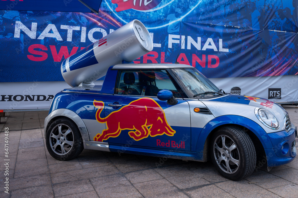 Red Bull advertising Mini Cooper car with logo. Giant Red Bull energy ...