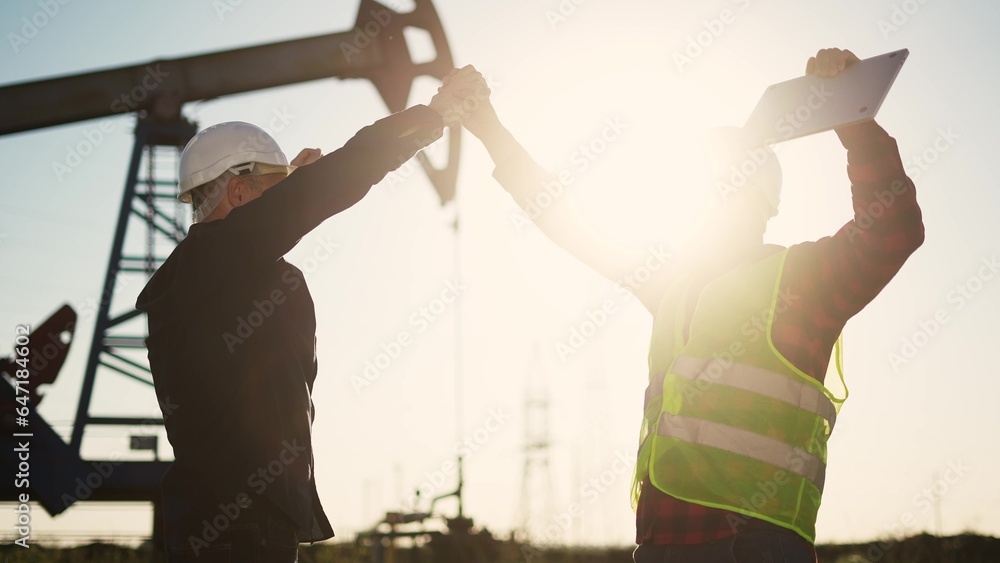 handshake business oil contract. handshake a worker and businessman ...