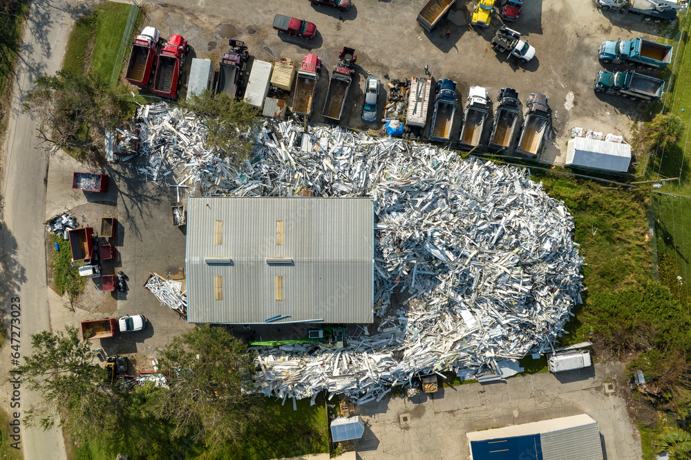 Beg pile of scrap aluminum metal siding from ruined houses after ...