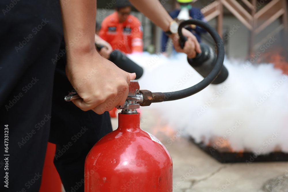 Employees firefighting training, Concept Employees hand using fire ...