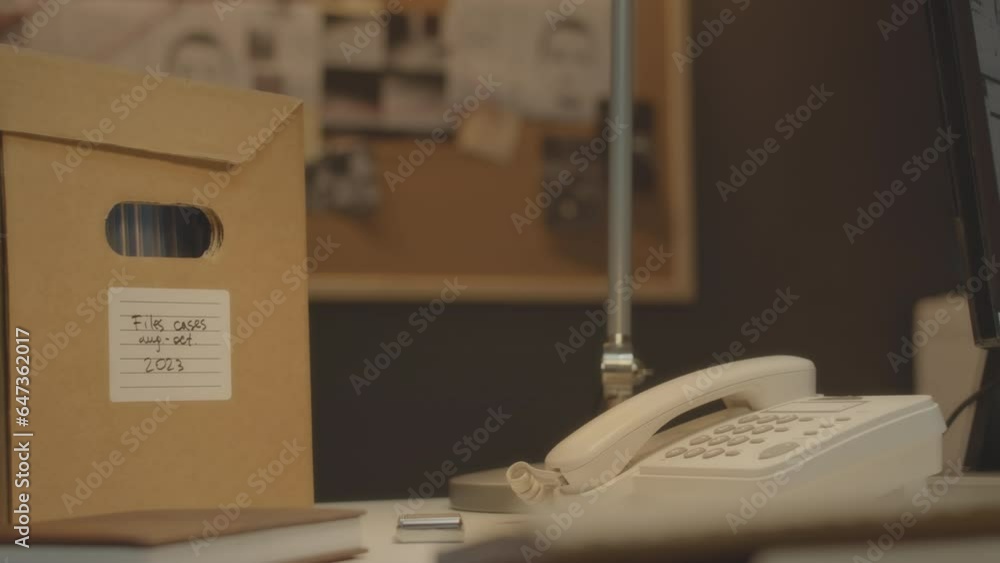 No people shot of cardboard box with evidence files and materials on ...