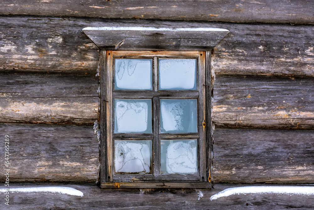 Old rectangular window with a wooden frame in an old log house. From ...