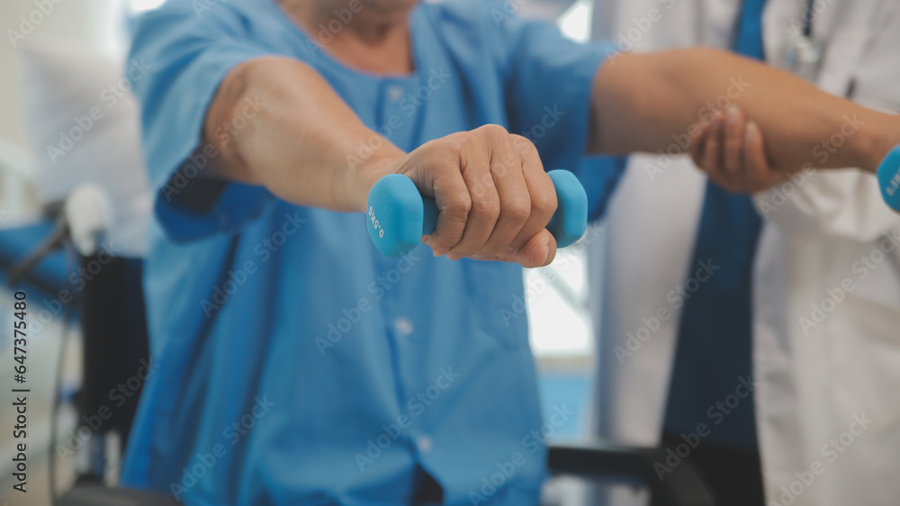Asian older aged man doing physiotherapist with support from nurse ...