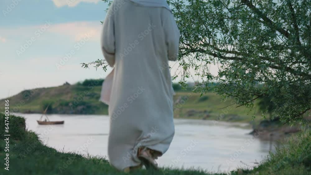 Jesus Christ meditate by the river Jordan with a fishing boat in ...