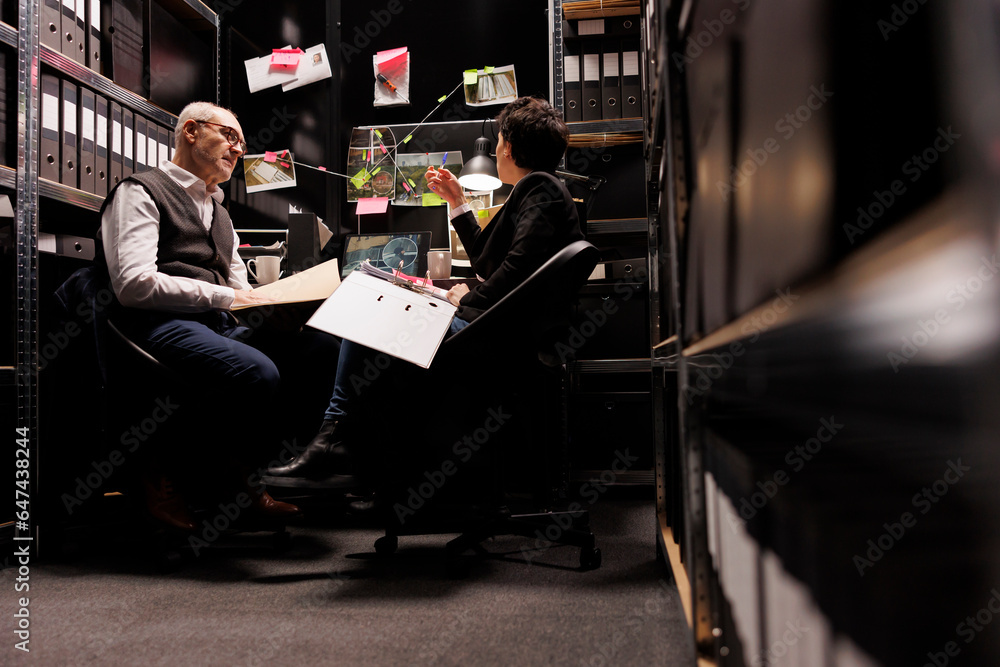 Investigators working overtime at criminal investigations in arhive ...