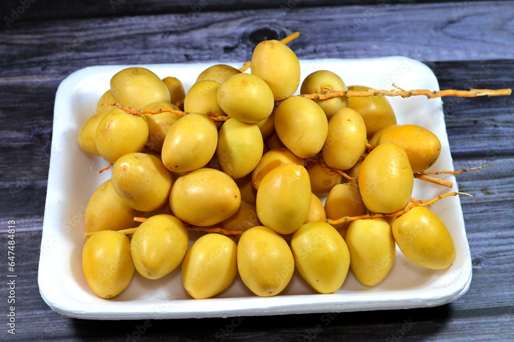 Yellow Barhi dates, botanically classified as Phoenix dactylifera ...