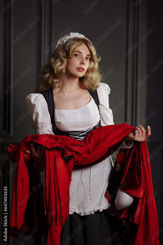 A skilled seamstress creates vintage medieval clothing with care and ...