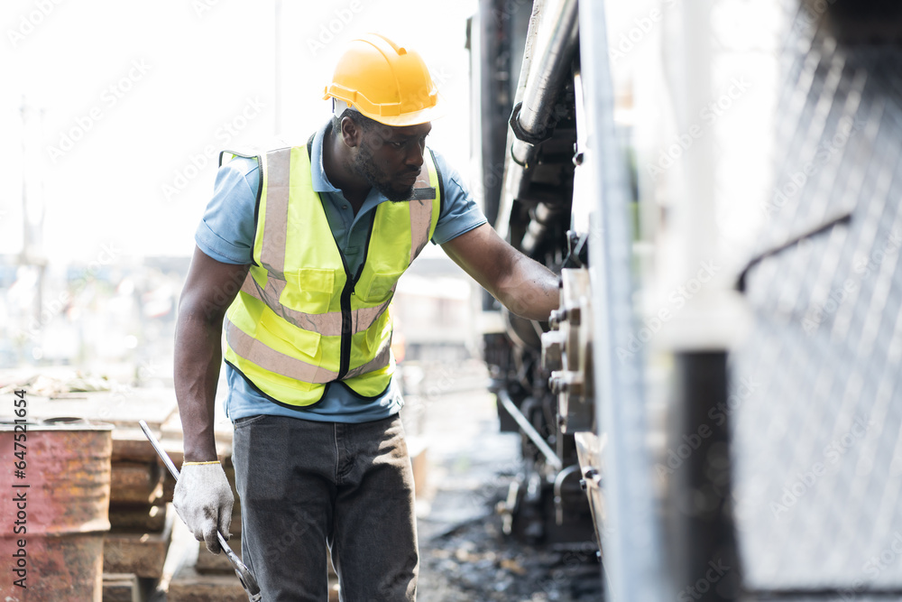 African American male engineer maintenance locomotive engine in ...