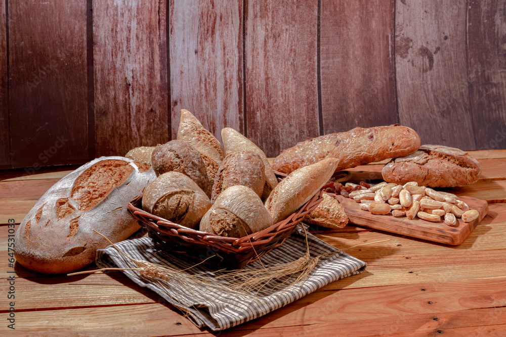 assortment of loaves and loaves of bread of different types of seeds on ...