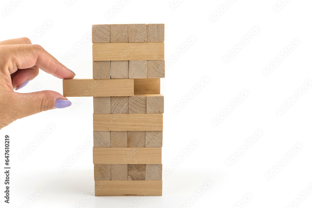 Building from wooden blocks. Wood blocks stack game with Hand on background. Conceptual of ...