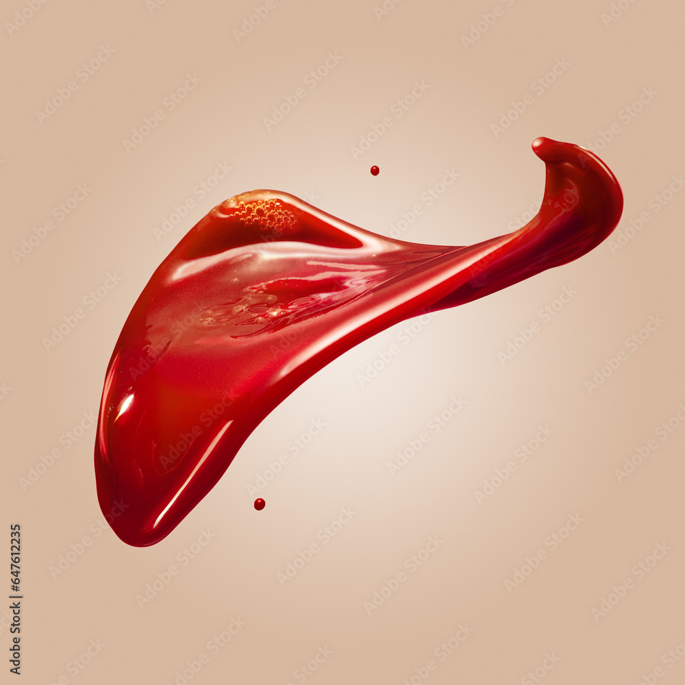 Levitating red splash isolated on brown background. Liquid paint, color ...
