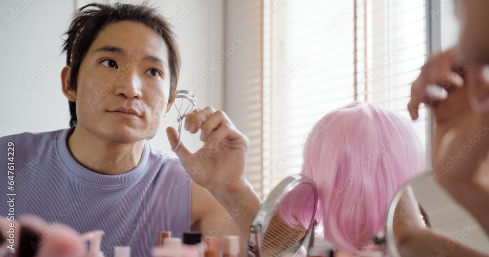 Gay queer man non-binary beauty blogger makeup artist at home cross ...