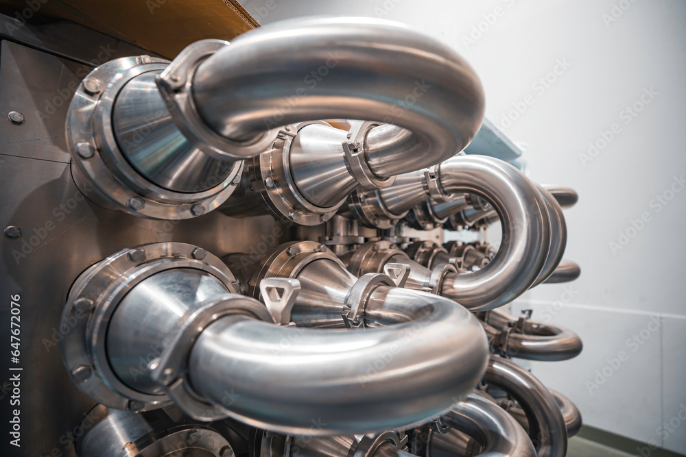 Industrial pipeline elbow system. Large, thick exchanger stainless ...