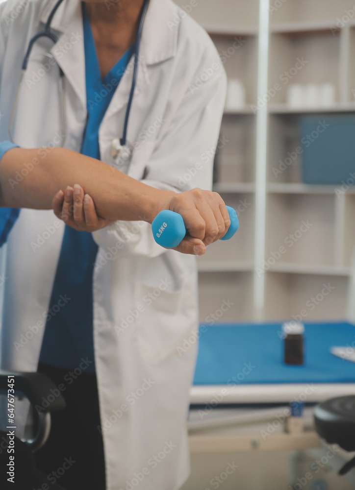 Asian older aged man doing physiotherapist with support from nurse ...